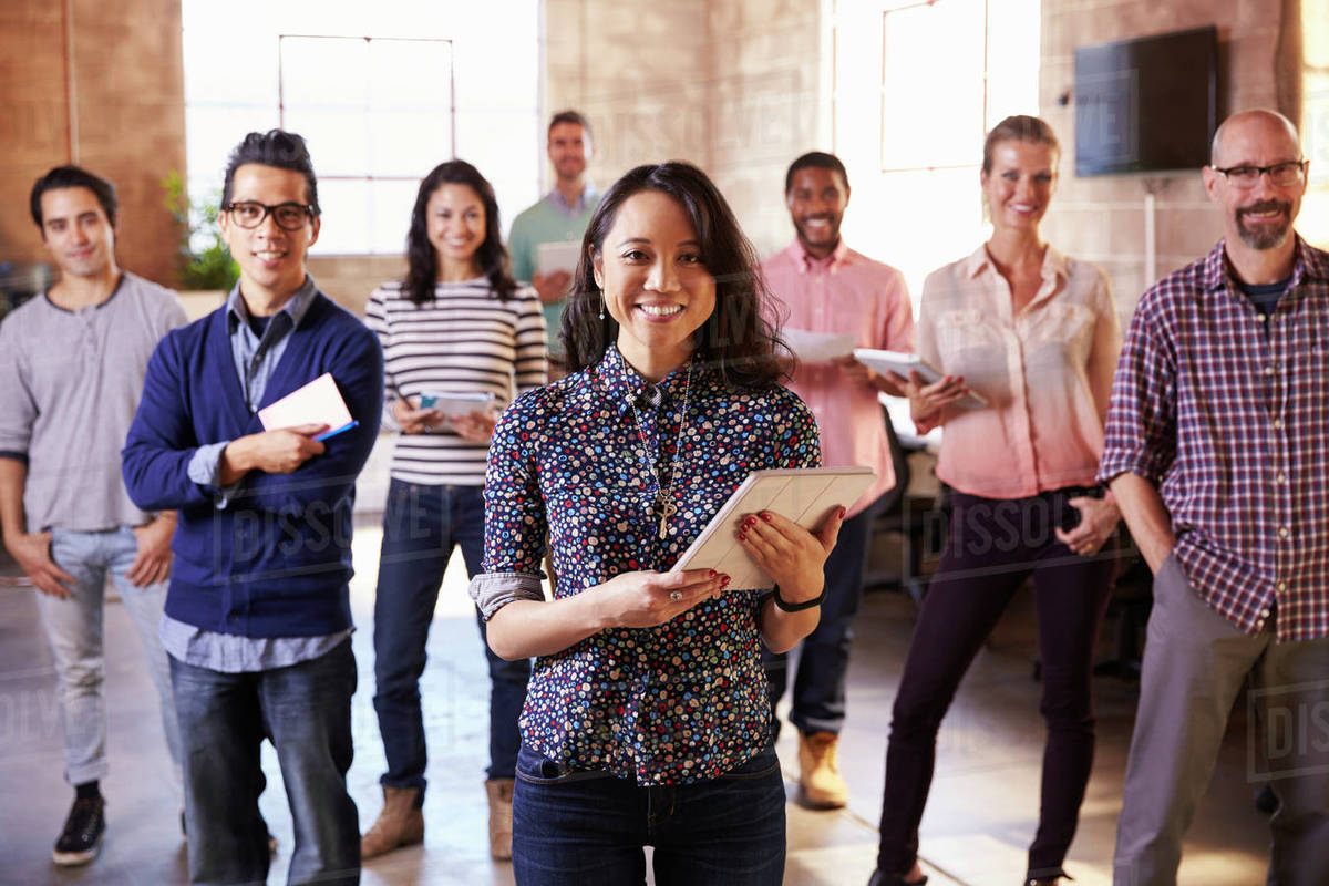 Portrait of staff standing in modern design office - Royalty-free Stock ...