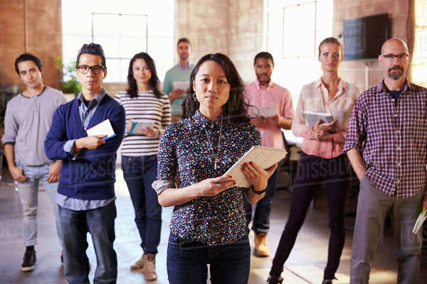 Portrait of staff standing in modern design office - Royalty-free Stock ...