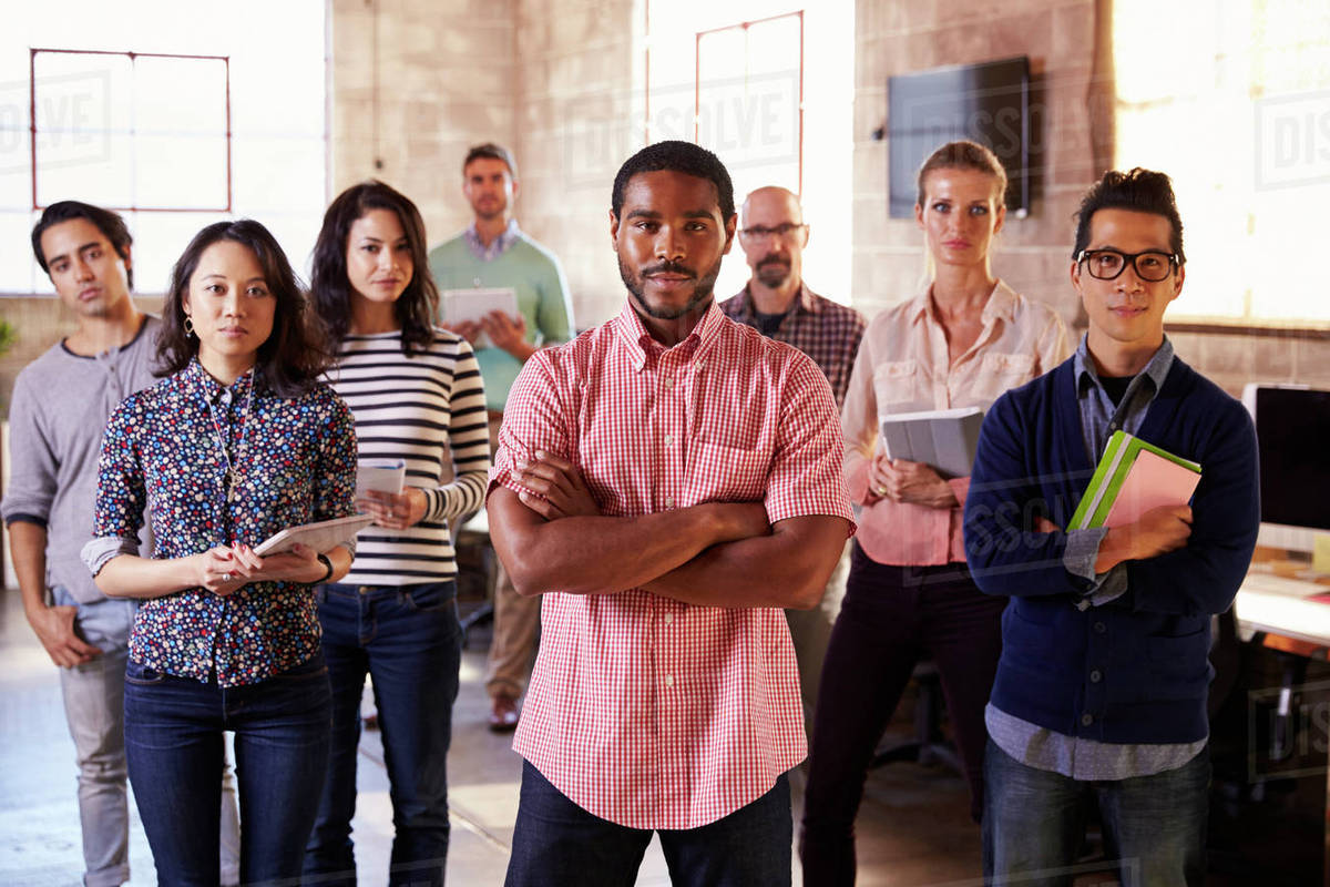 Portrait of staff standing in modern design office - Royalty-free Stock ...