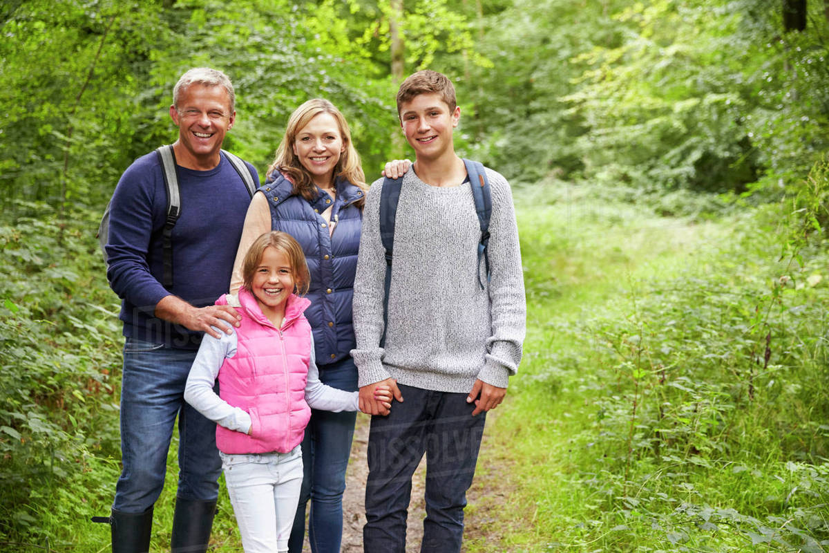 Portrait Of Family On Walk Through Beautiful Countryside - Royalty-free ...