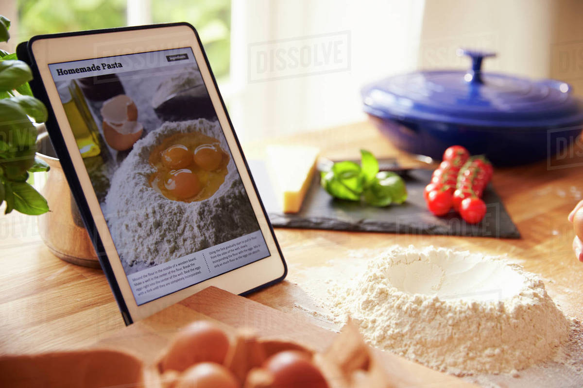 Following pasta recipe using app on digital tablet - Royalty-free Stock ...