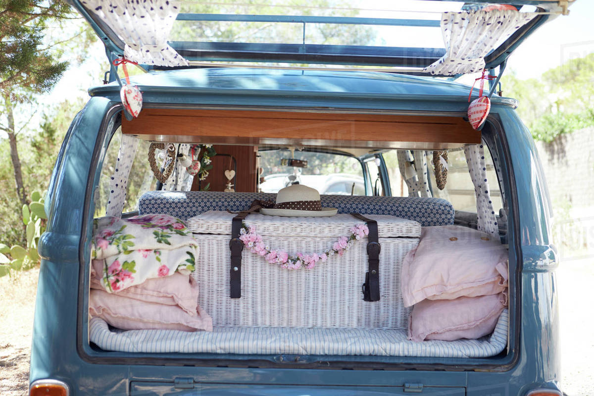 Open back of a retro camper van, with luggage and cushions - Stock ...