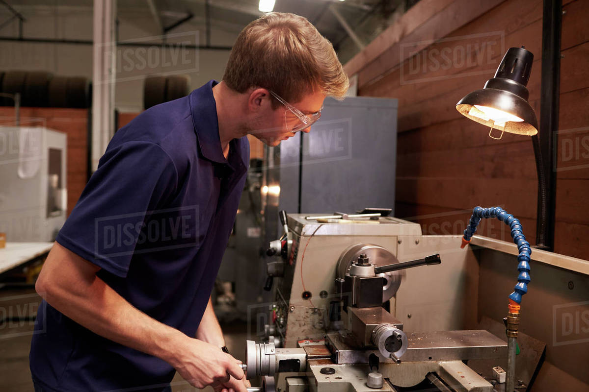 Male engineer in factory using milling machine - Royalty-free Stock ...