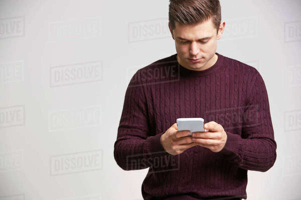 Portrait of a young white man using a smartphone - Royalty-free Stock ...