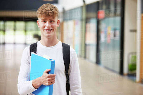 Portrait Of Male Student Standing In College Building - Stock Photo ...