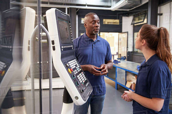 Engineer Showing Apprentice How To Use CNC Tool Making Machine - Stock ...