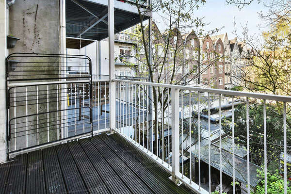 Balcony with metal railing of residential low rise house with typical ...