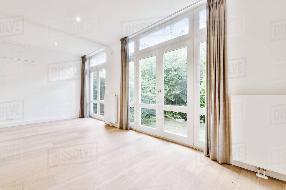 Large room interior in luxury residental building - Stock Photo - Dissolve