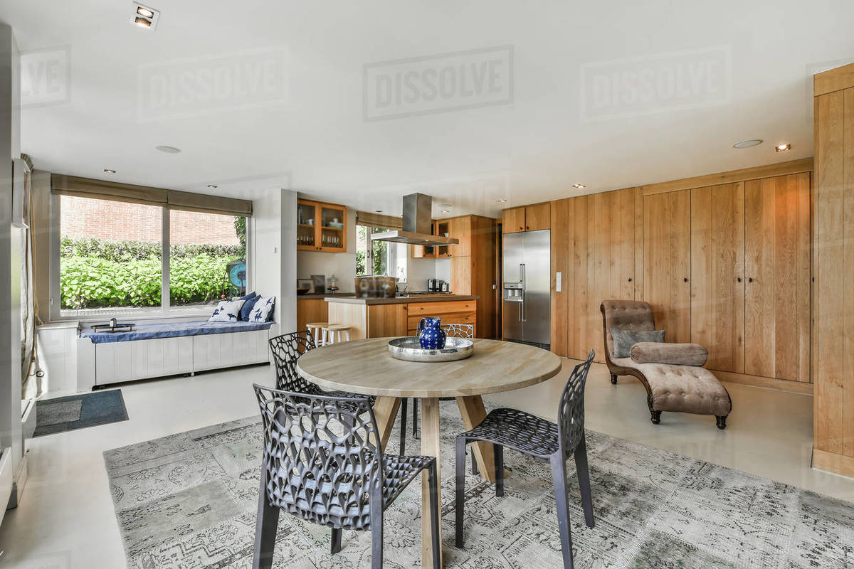 Modern dining room in a luxury house with individual design - Royalty ...