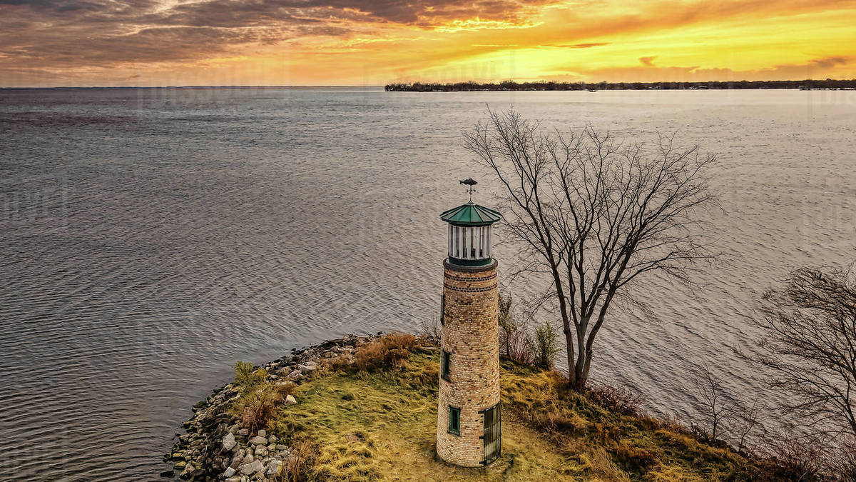 Romantic sunset over old lighthouse at public park. - Royalty-free ...