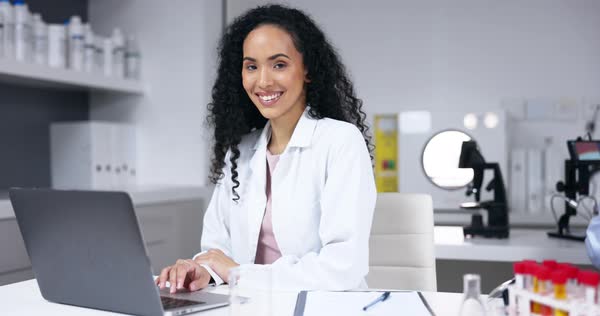 Laptop, smile and face of scientist typing in laboratory for online ...