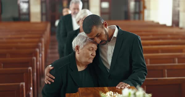 Church, funeral and senior mother and man hug for mourning death by ...