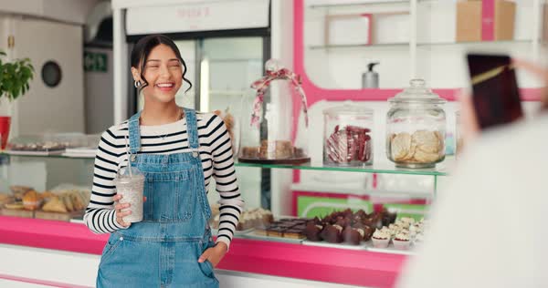 Milkshake, smile and photograph of a woman in a bakery for a social ...