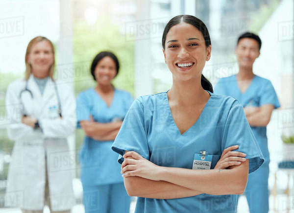 Portrait, medical and a woman nurse arms crossed, standing with her ...