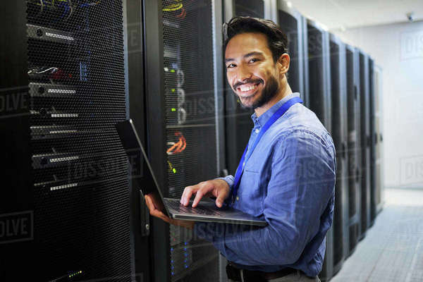 Man, engineering computer and server room, data center and portrait for ...