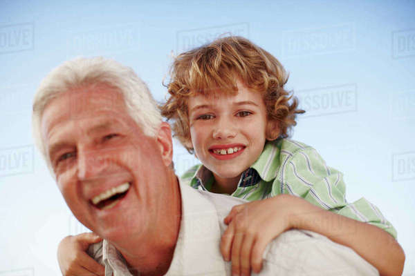 Portrait, grandfather and boy with a smile, piggy back and bonding ...