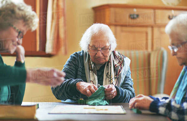 Senior women, board game and nursing home friendship or old people ...