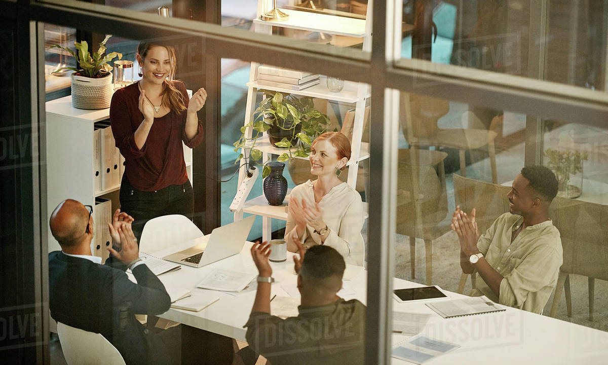 Successful team clapping hands, cheering during deal or meeting in ...