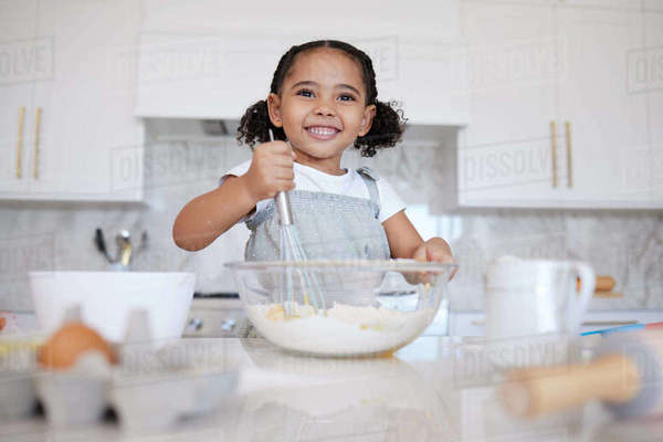 Happy girl kids baking in kitchen, house and home for childhood fun ...