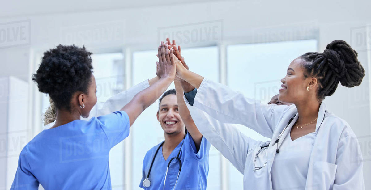 Success, high five and teamwork with doctors in hospital cheering for ...