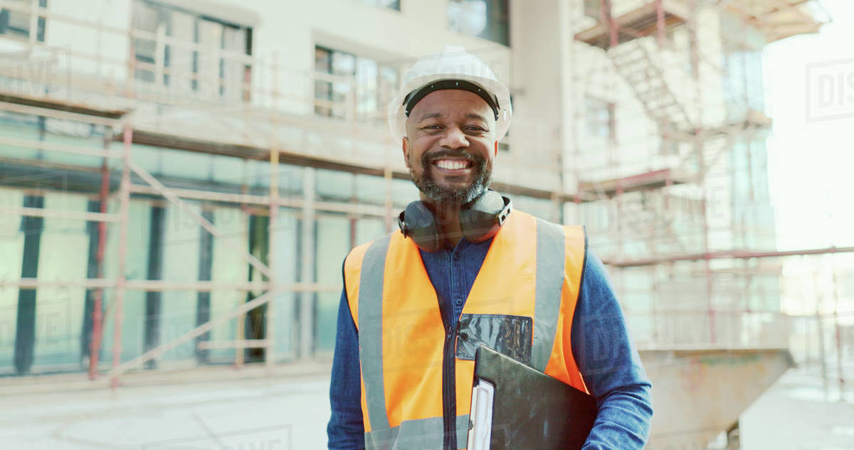 Black man, construction site and architect, inspection and smile in ...
