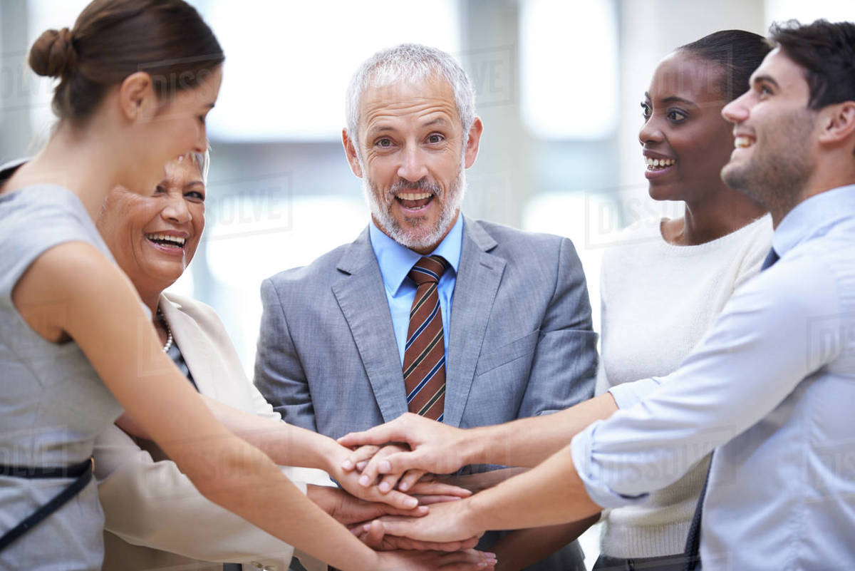 Portrait, business people and hands together for teamwork, cooperation and solidarity. Group ...