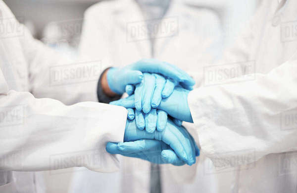 Doctor, team and hands together with gloves in healthcare, partnership ...