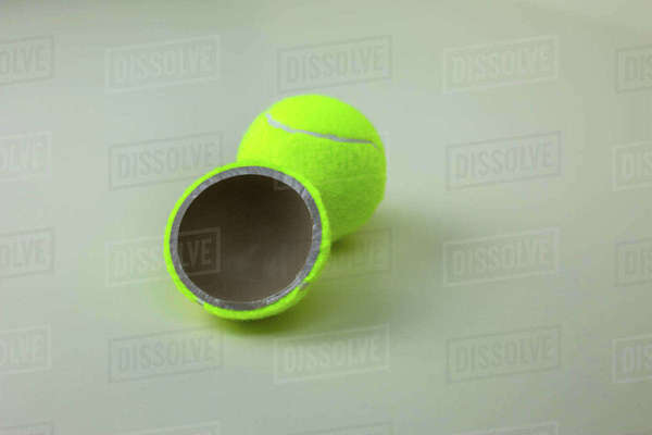 Tennis ball cut in half. The hemisphere of a rubber ball for sports is ...