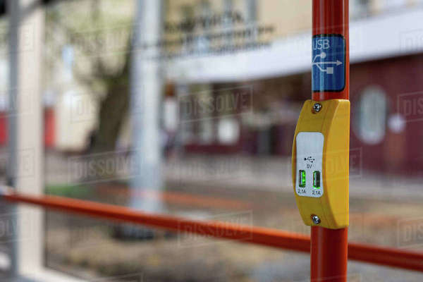 Handrail of modern public transport with USB connector for charging ...