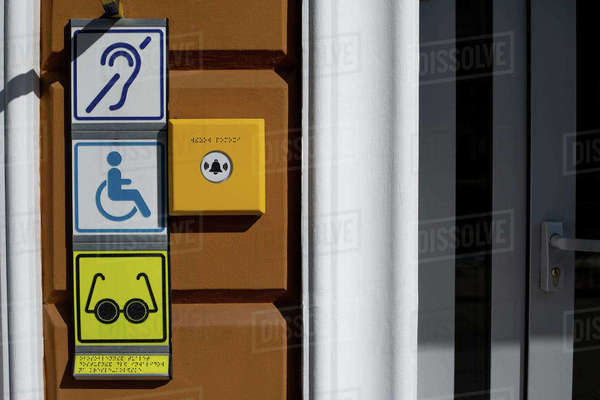 Set of signs characterizing people with disabilities next to button for ...