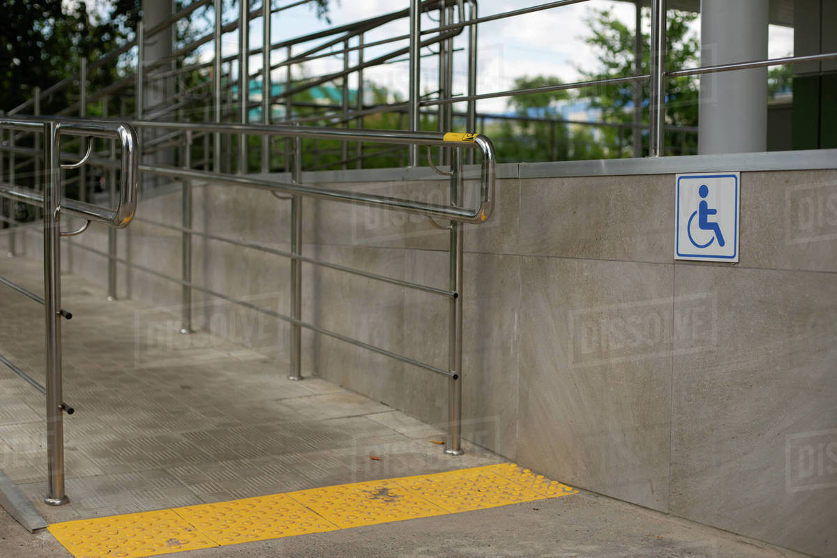 Street ramp for people with disabilities in a wheelchair. Entrance to ...