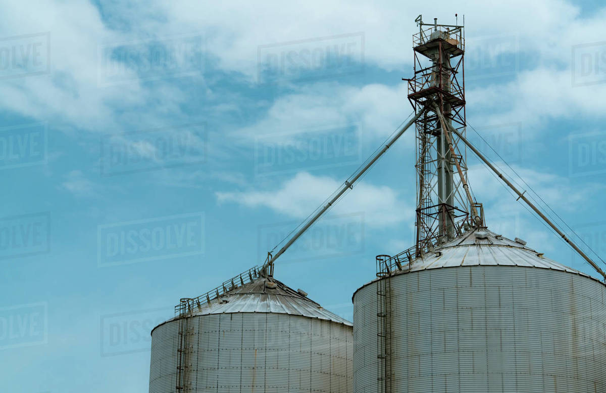Agricultural silo at feed mill factory. Silo for store and drying grain ...