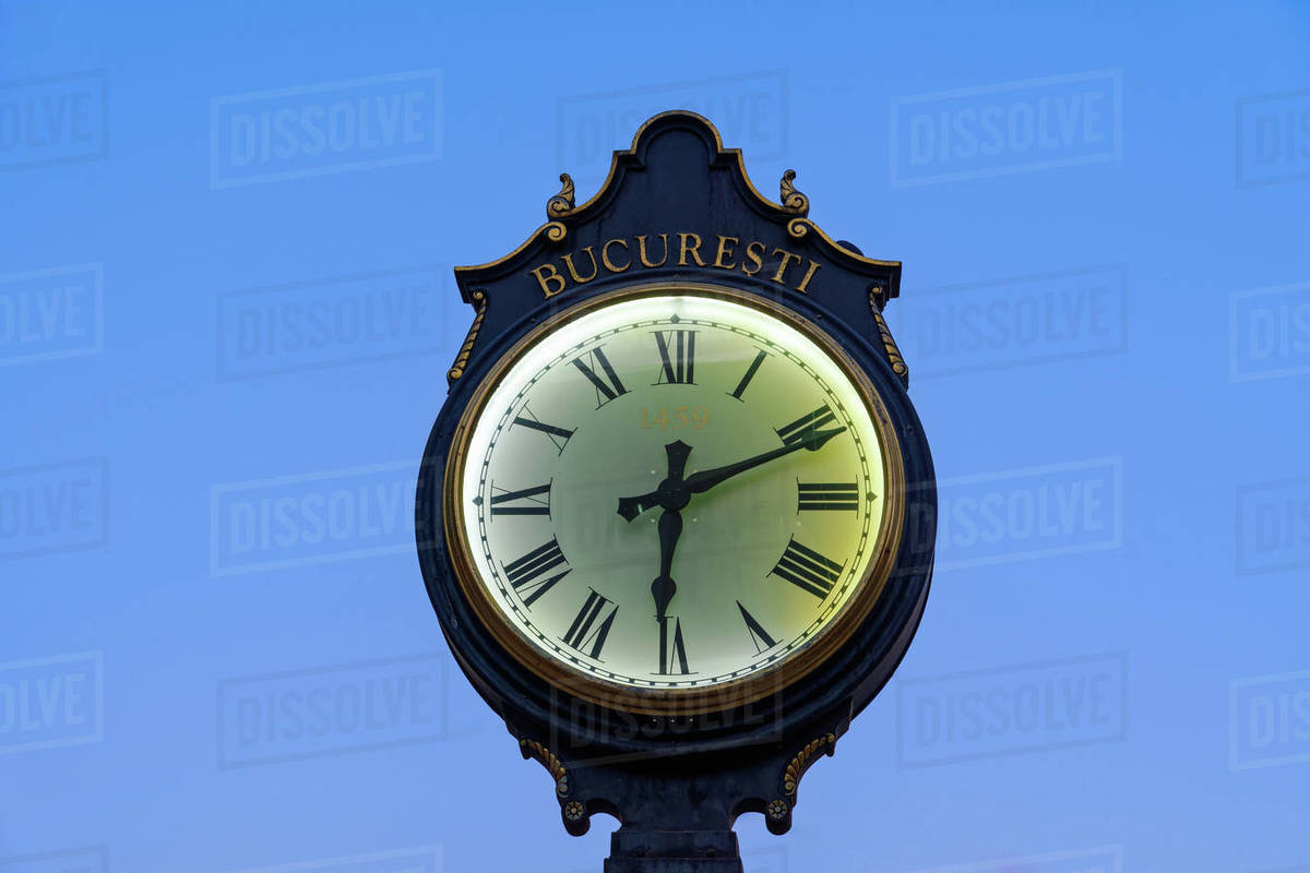 A traditional big public clock in Romania displaying the time with the ...