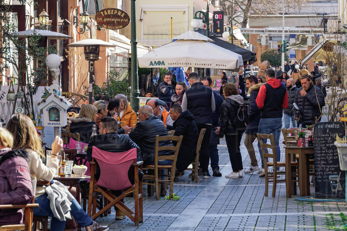 Xanthi, Greece crowd seated on open air tables eating or drinking ...