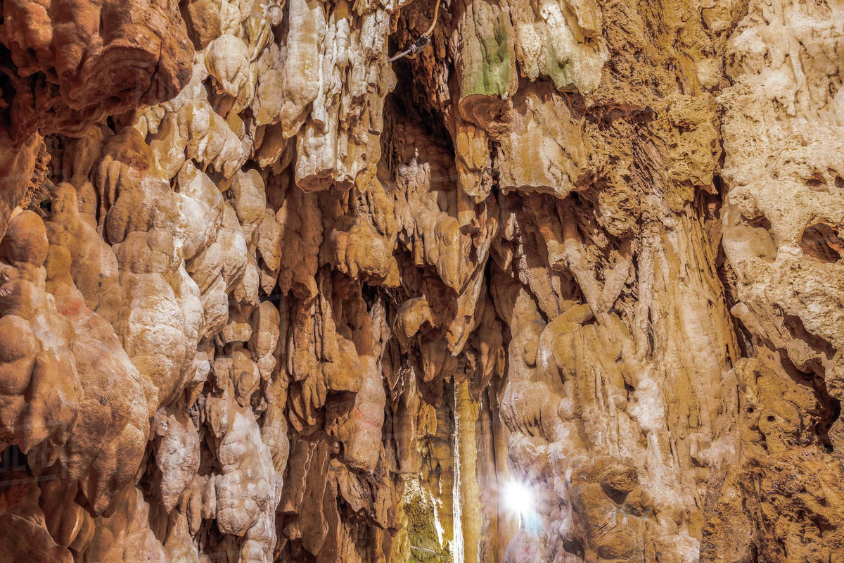 Limestone stalactites mineral formation hanging from the ceiling inside ...