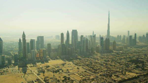 Downtown Dubai skyline Burj Khalifa and suburbs helicopter blades ...