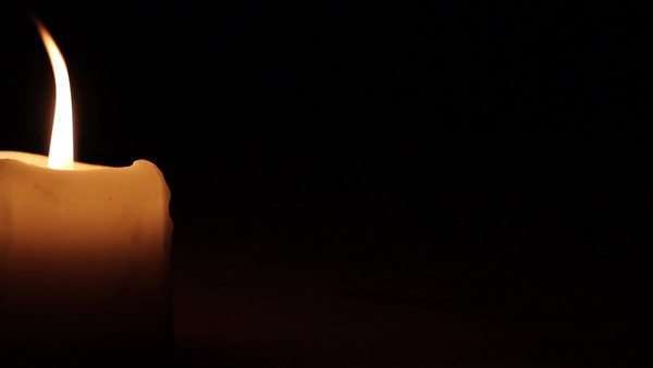 A Candle Flame Flickering and Blowing in the Wind, Panning Shot - Stock ...