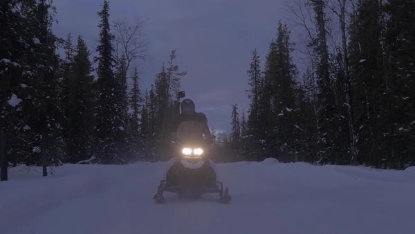 Snowmobile riders taking pictures. Reverse tracking shot. - HD Royalty ...