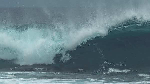 Awesome shot of huge tube wave crashing near remote exotic island ...