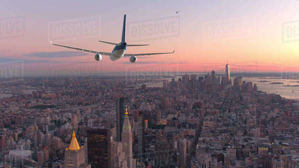 AERIAL, CLOSE UP: Passenger airplane flying over breathtaking downtown ...