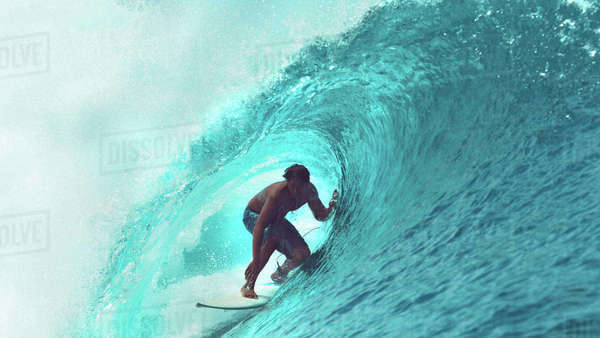 CLOSE UP: Exreme athlete surfs a big barrel ocean wave glistening in ...