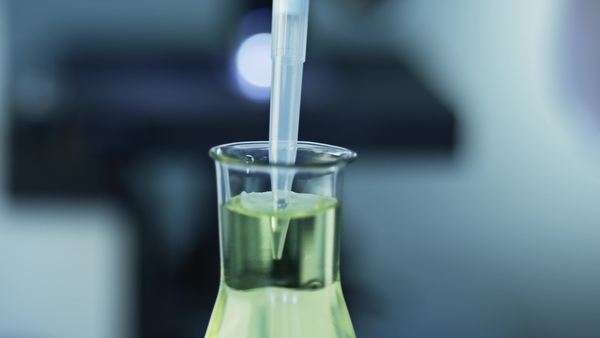 Using digital dropper in laboratory - Stock Video Footage - Dissolve