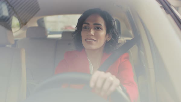 Portrait of Beautiful Young Woman Driving Car through Sunny Suburban ...