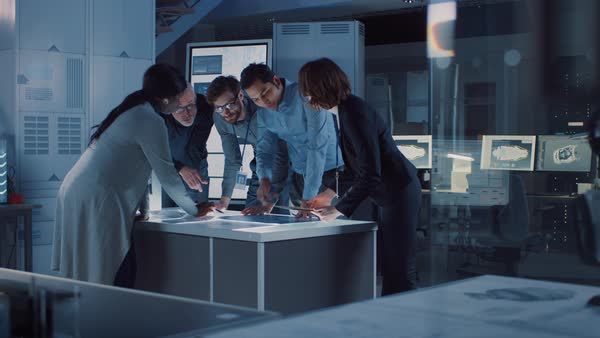 Engineers meeting in technology research laboratory: engineers ...