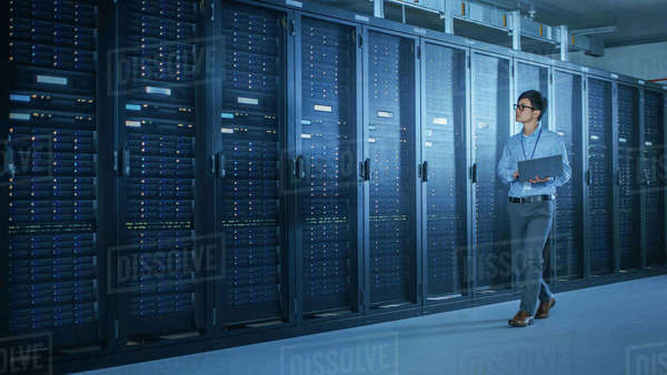 In Data Center: Male IT Technician Running Maintenance Program on a ...