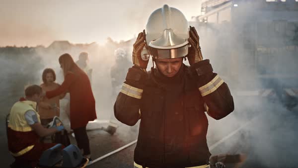 Portrait of the brave firefighter taking off his helmet - 4K Royalty ...