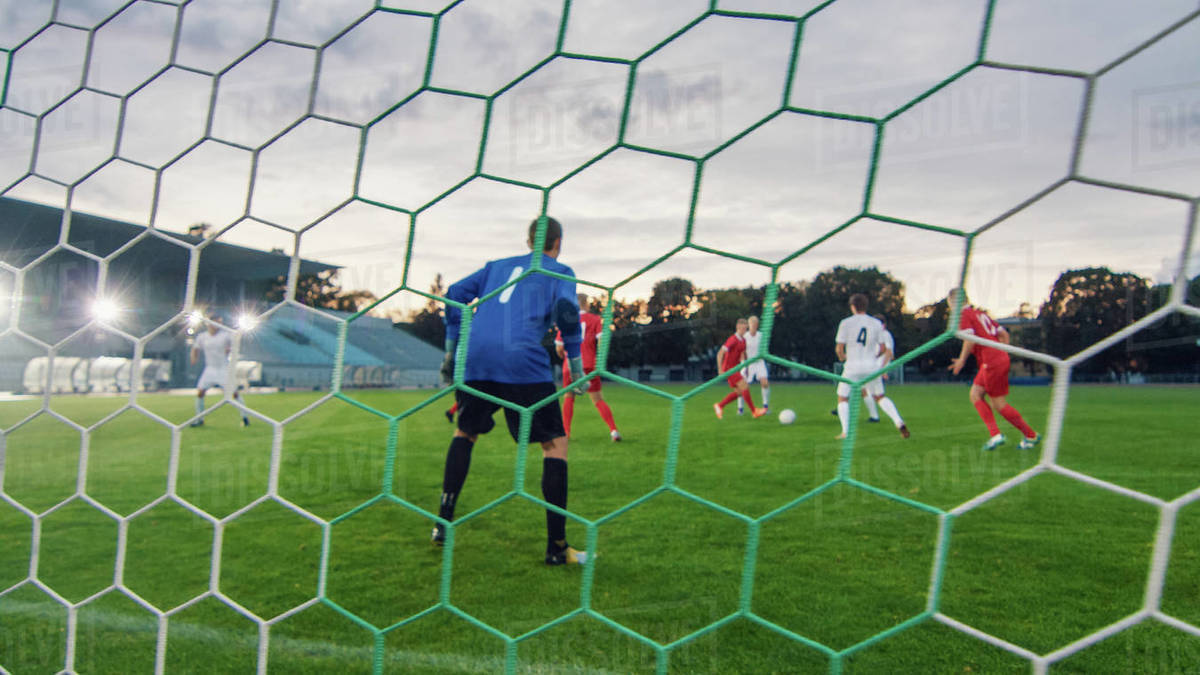 Shot from Behind the Net with whole Stadium Visible. Soccer ...
