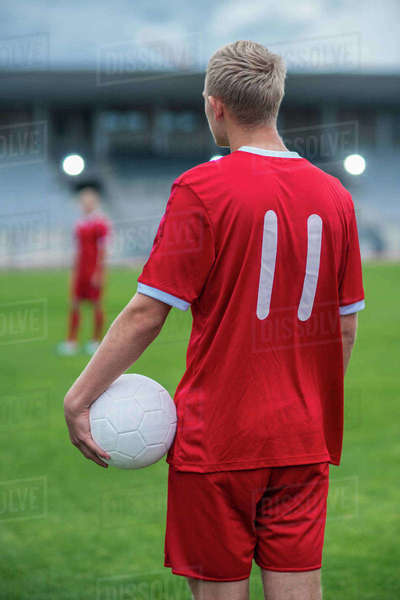 Back Shot of a Professional Football Player Standing on a Stadium ...