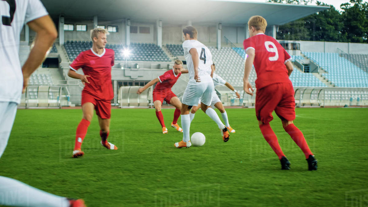 Shot of Professional Soccer Player Leads with a Ball, Masterfully ...