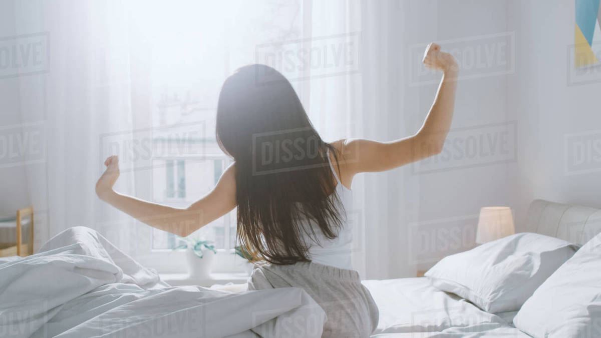 Beautiful Brunette Slowly Waking up in the Morning, Stretches and Gets ...